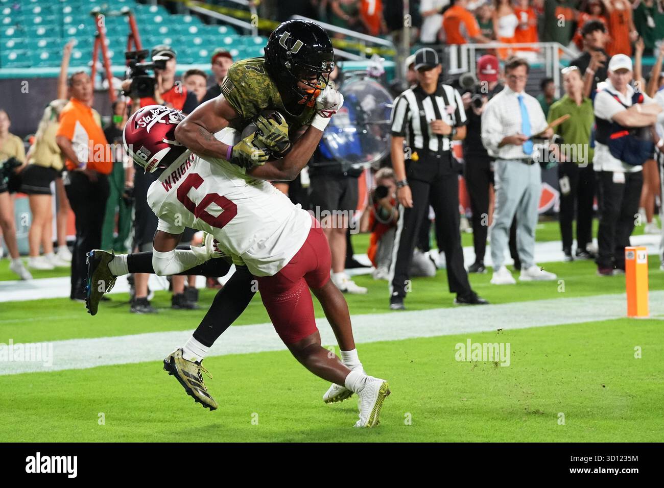 Miami wide receiver CJ Daniels makes a catch for a touchdown as Stanford cornerback Collin ...