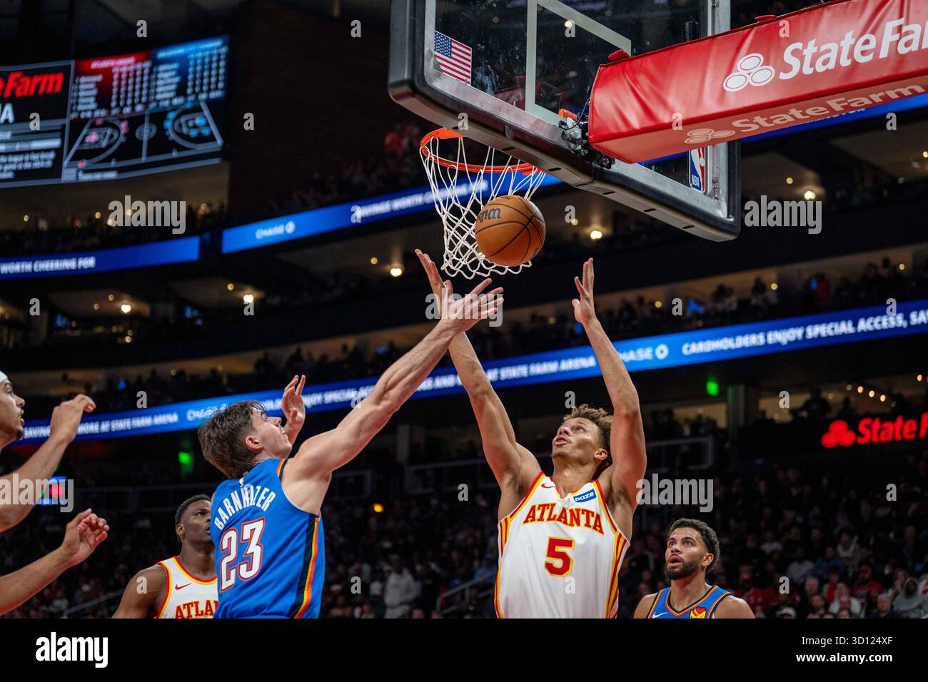 Atlanta Hawks guard Dyson Daniels (5), right, attempts to gain ...