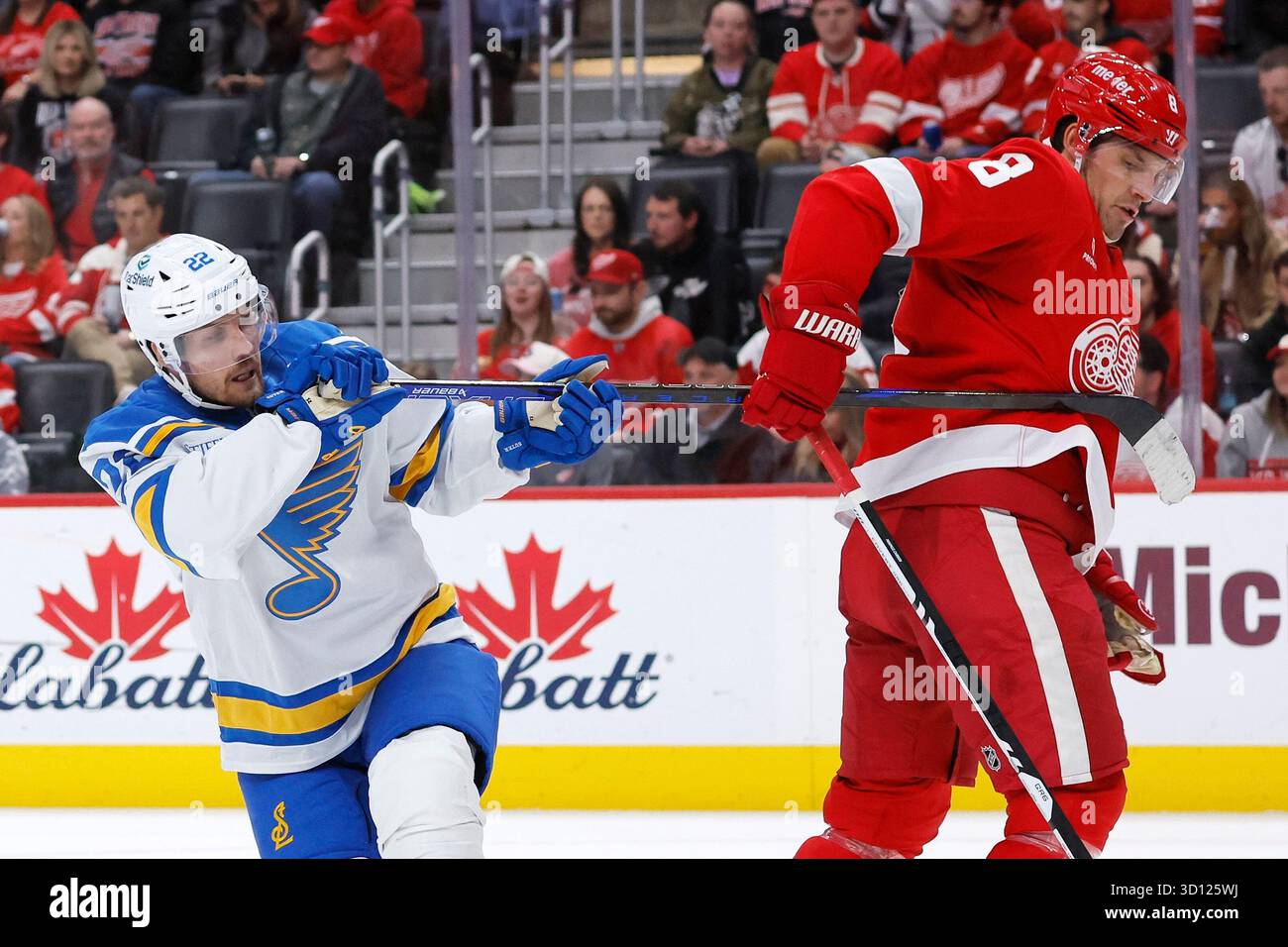 Detroit Red Wings defenseman Ben Chiarot (8) pulls on the stick of St ...