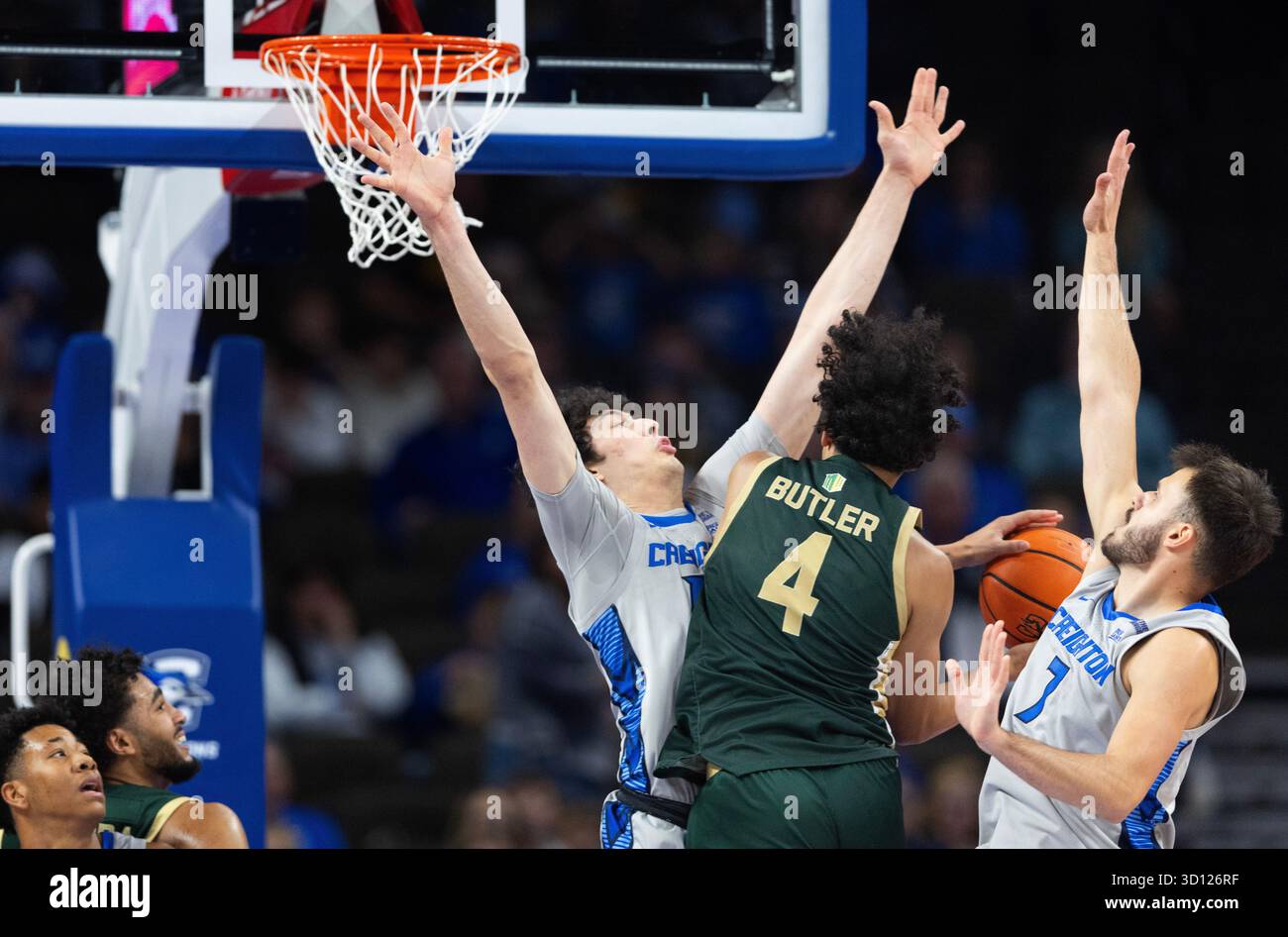 Colorado State's Jase Butler (4) shoots against Creighton's Kerem Konan ...