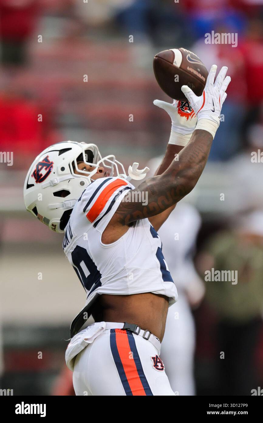 October 25, 2025: Tigers running back Omar Mabson II (29) reaches for a ...