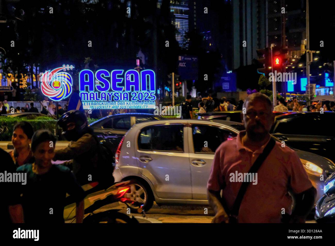 people walk past the ASEAN 47th Summit billboard during ASEAN Malaysia ...