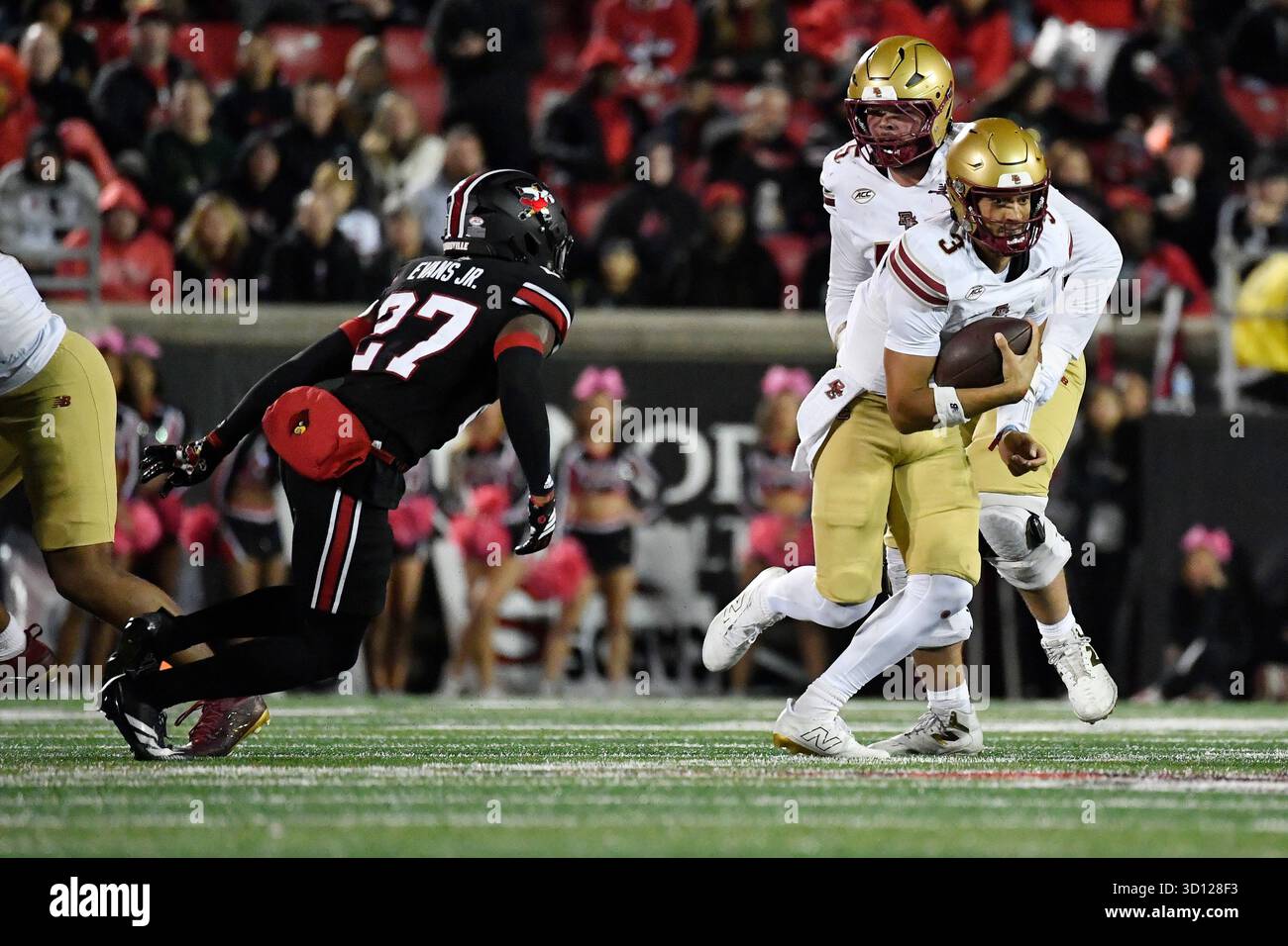 Boston College quarterback Grayson James (3) runs from the pursuit of ...