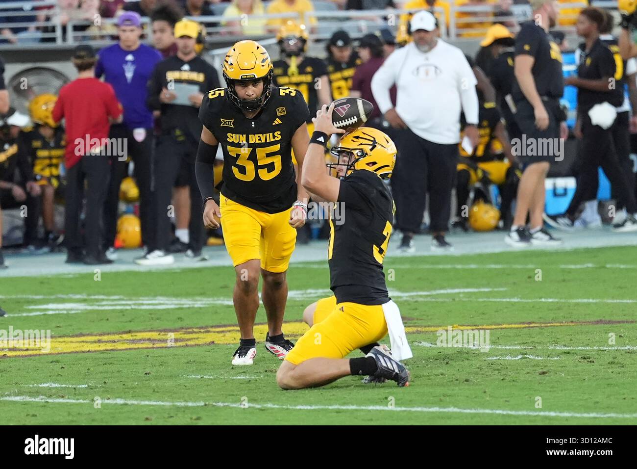 Arizona State kicker Jesus Gomez (35) watches a high snap caught by ...