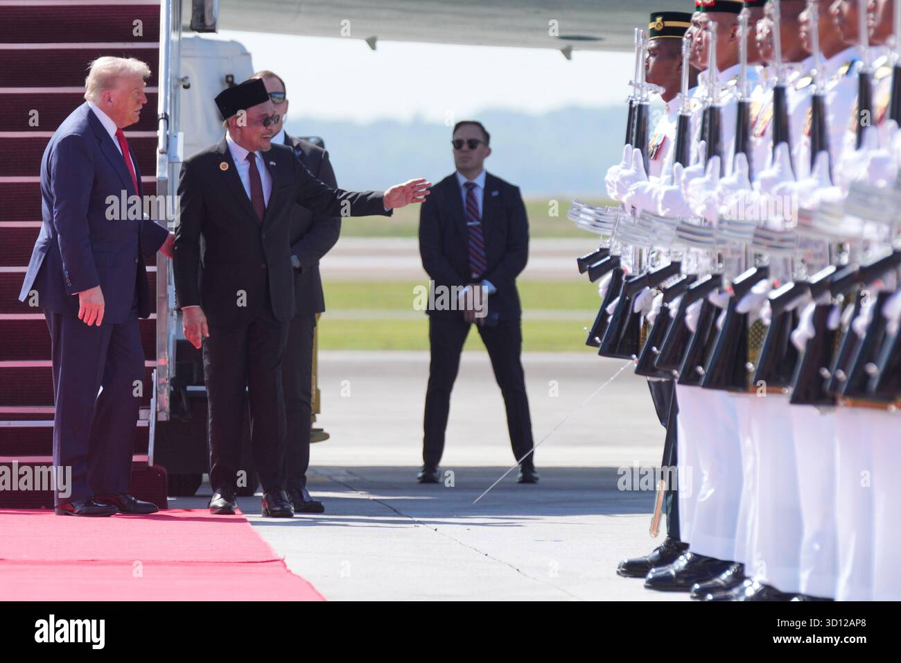 President Donald Trump is greeted by Malaysia's Prime Minister Anwar ...