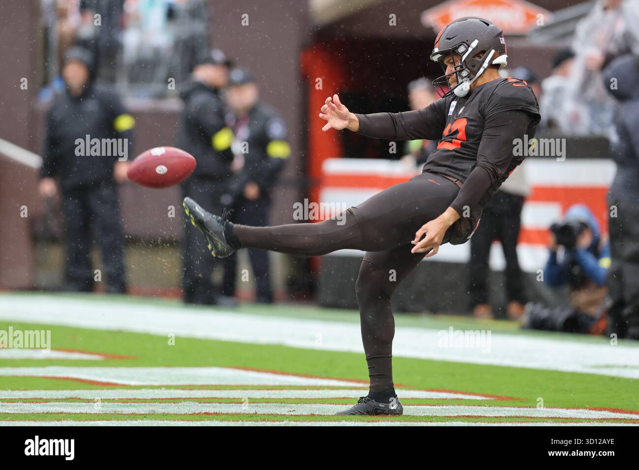Cleveland Browns punter Corey Bojorquez (13) kicks the ball against the ...