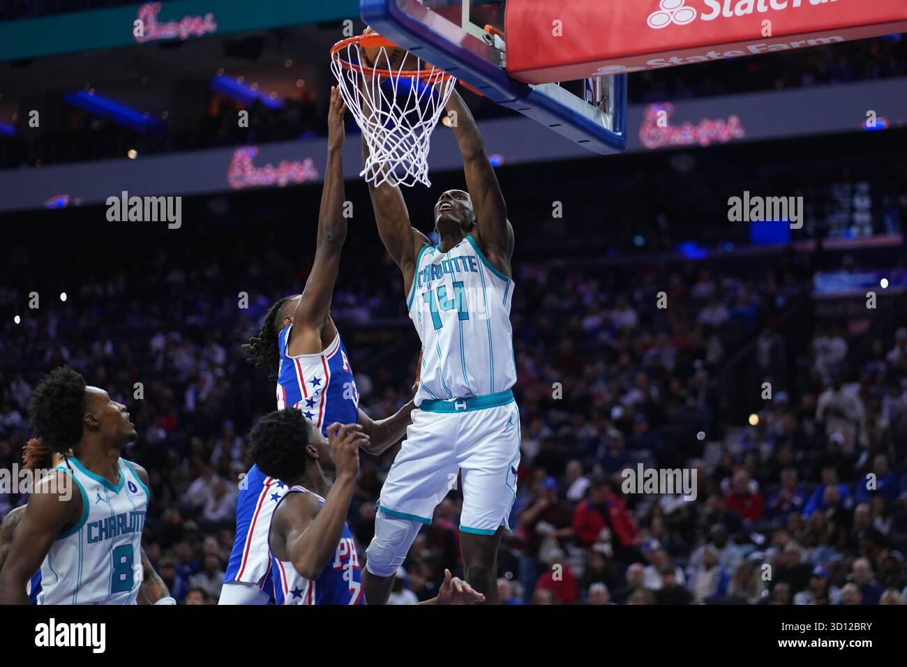Charlotte Hornets' Moussa Diabate, right, tries to dunk against ...