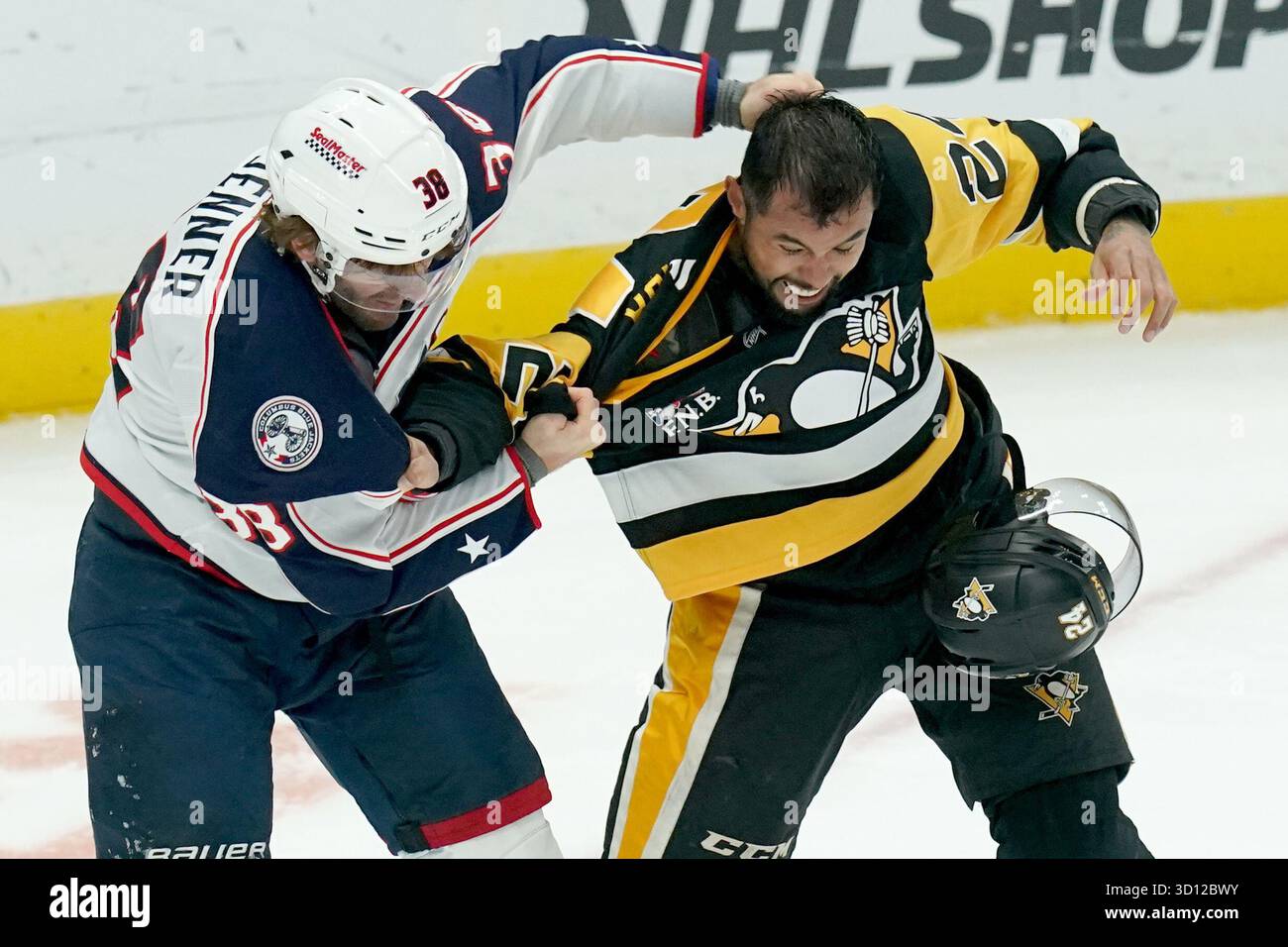Columbus Blue Jackets' Boone Jenner (38) fights Pittsburgh Penguins ...