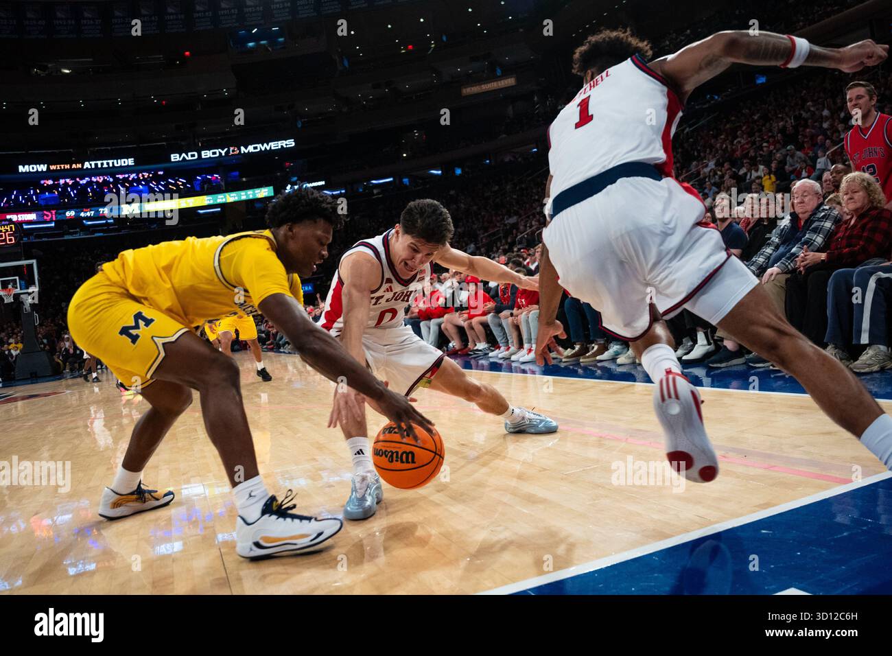 Michigan guard L.J.C.ason, left, and St. John guard Dylan Darling ...