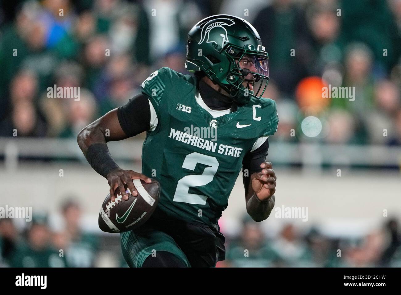 Michigan State quarterback Aidan Chiles runs with the ball during the ...