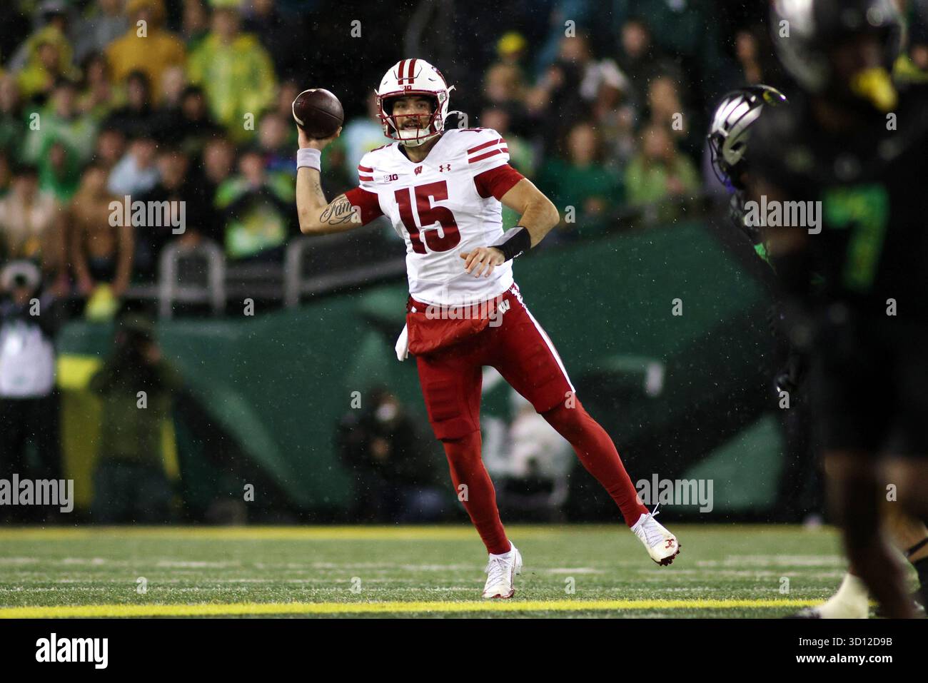 Wisconsin quarterback Hunter Simmons (15) looks to pass the ball during ...