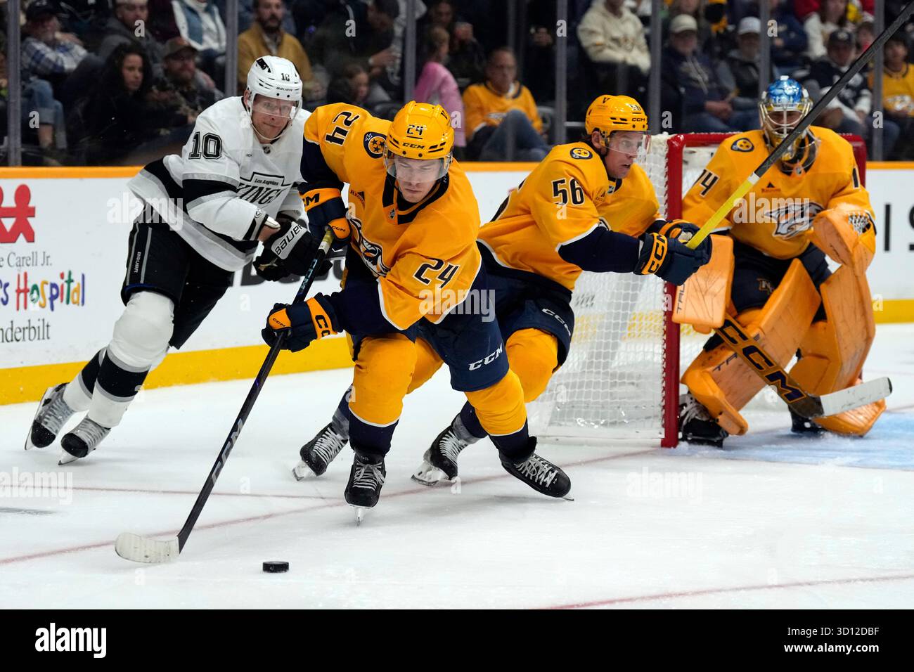 Nashville Predators defenseman Spencer Stastney (24) clears the puck ...