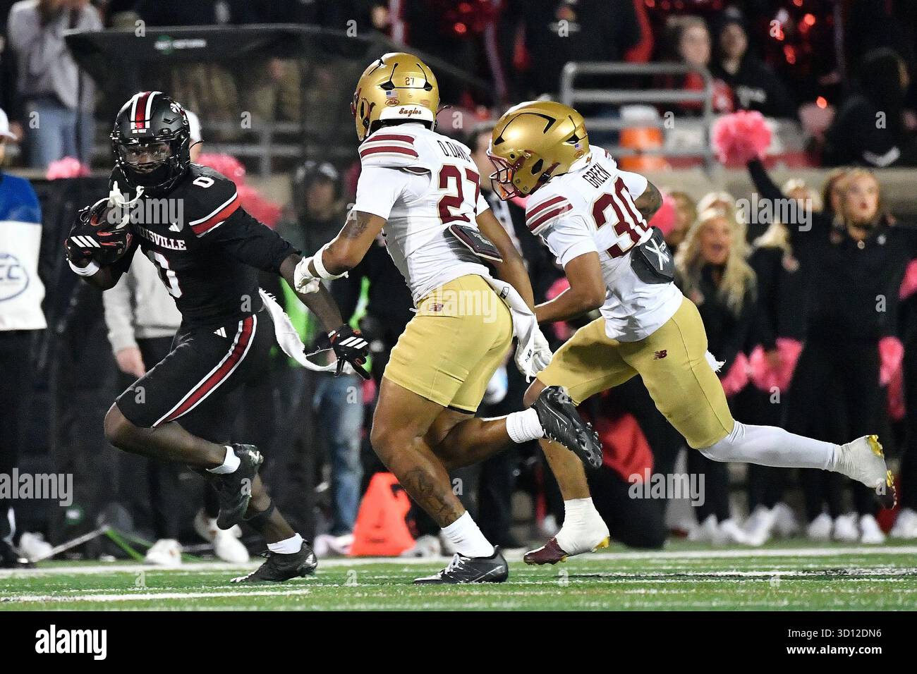 Louisville wide receiver Chris Bell, left, runs from Boston College ...