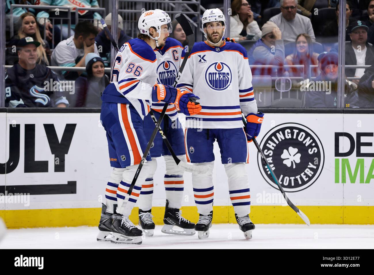 Edmonton Oilers defenseman Evan Bouchard (2), right, is congratulated ...