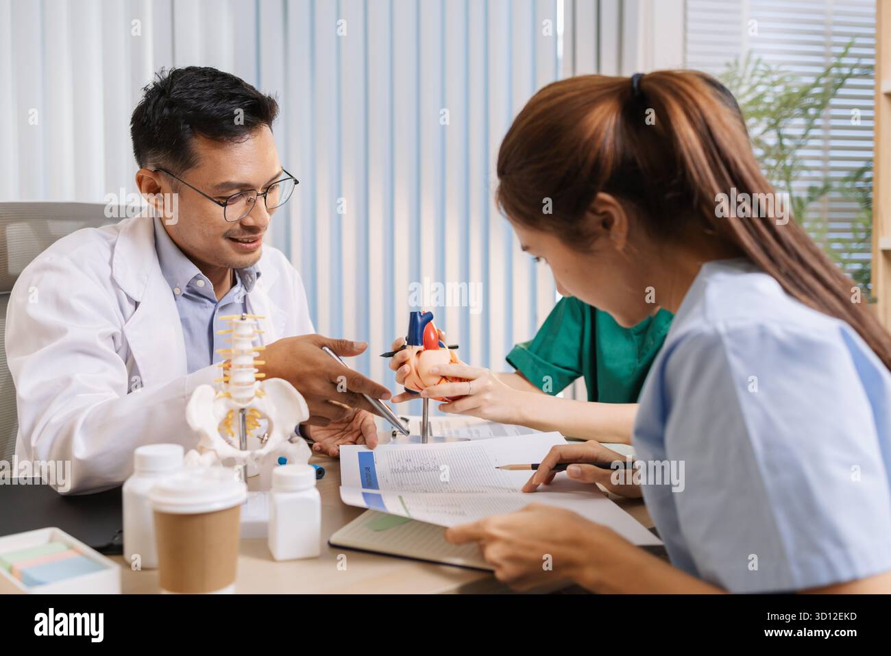Team of doctors and nurses collaborating in a clinical environment ...