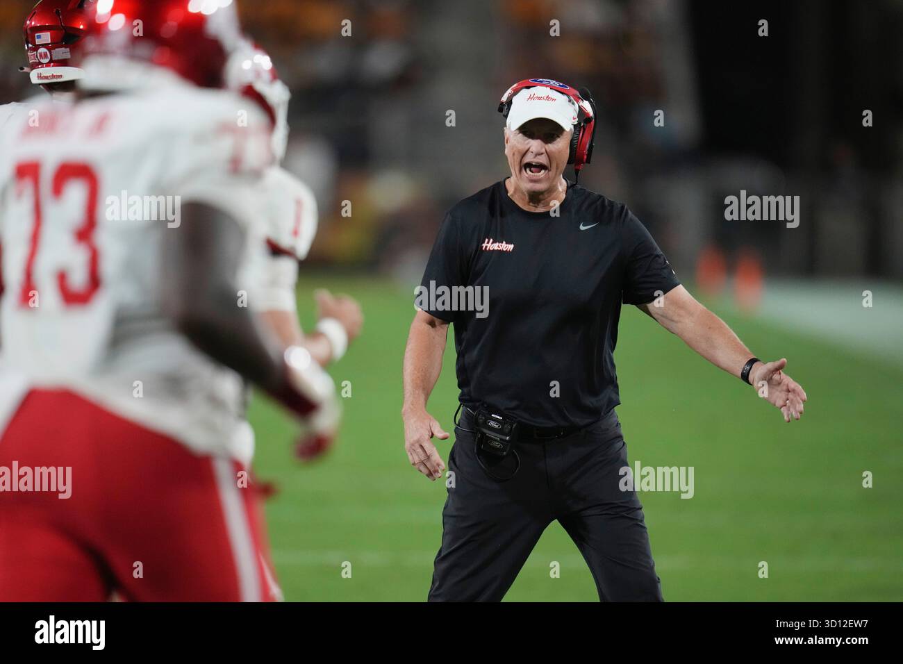 Houston head coach Willie Fritz celebrates with players after a ...