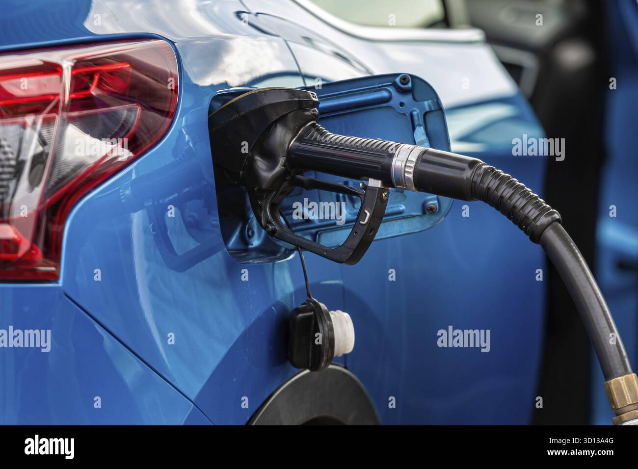Refueling Car fill with petrol gasoline at gas station and petrol pump ...