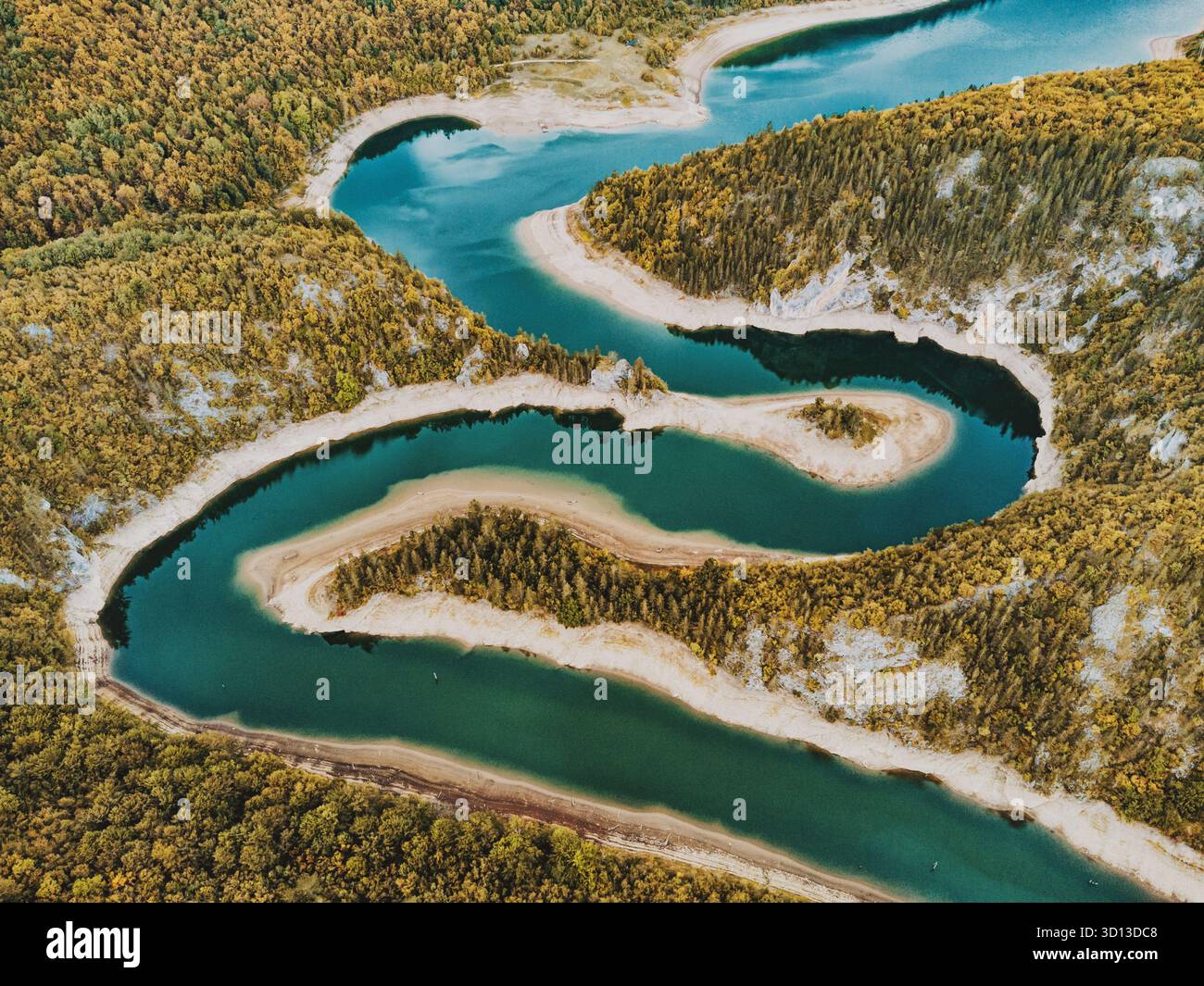 Aerial view of winding river Cehotina meanders surrounded by forested ...