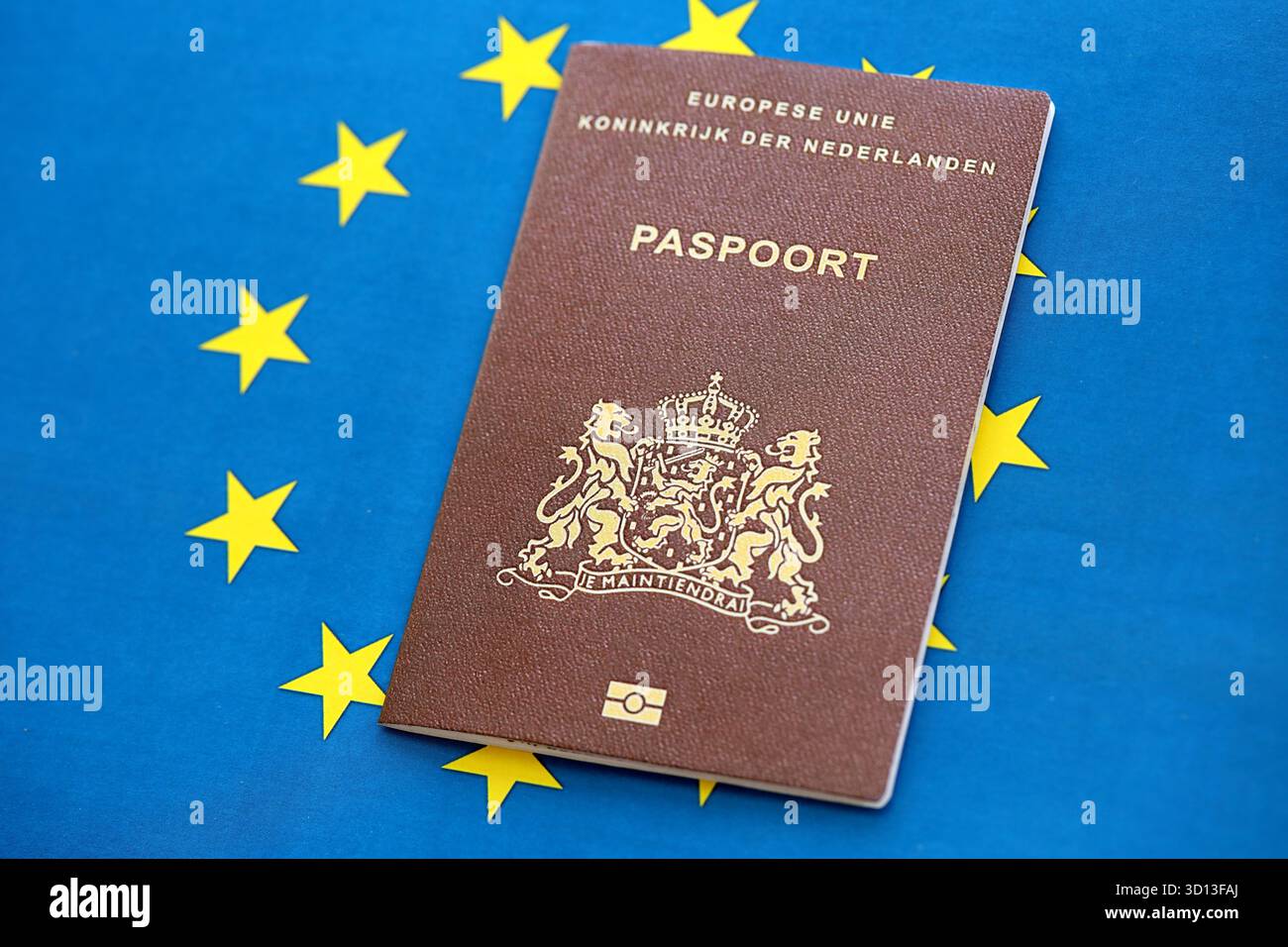 Netherlands passport on European union blue flag background close up ...
