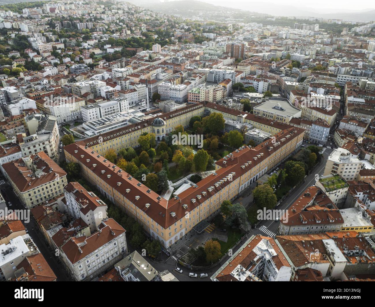 Aerial view of the grand Piazza dell'Ospitale unfolds, its symmetrical ...