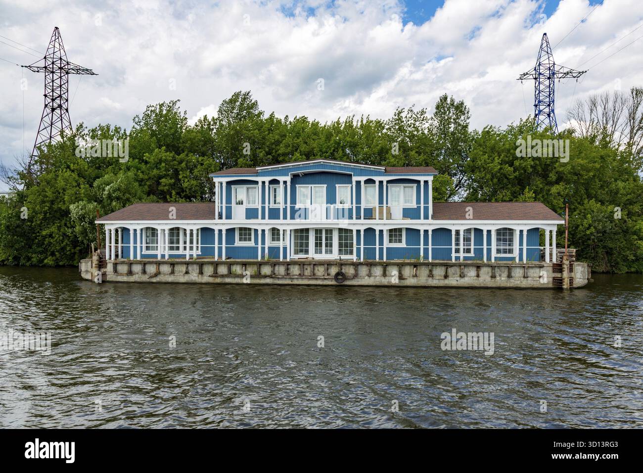 Cozy house of blue planks on the river Stock Photo - Alamy