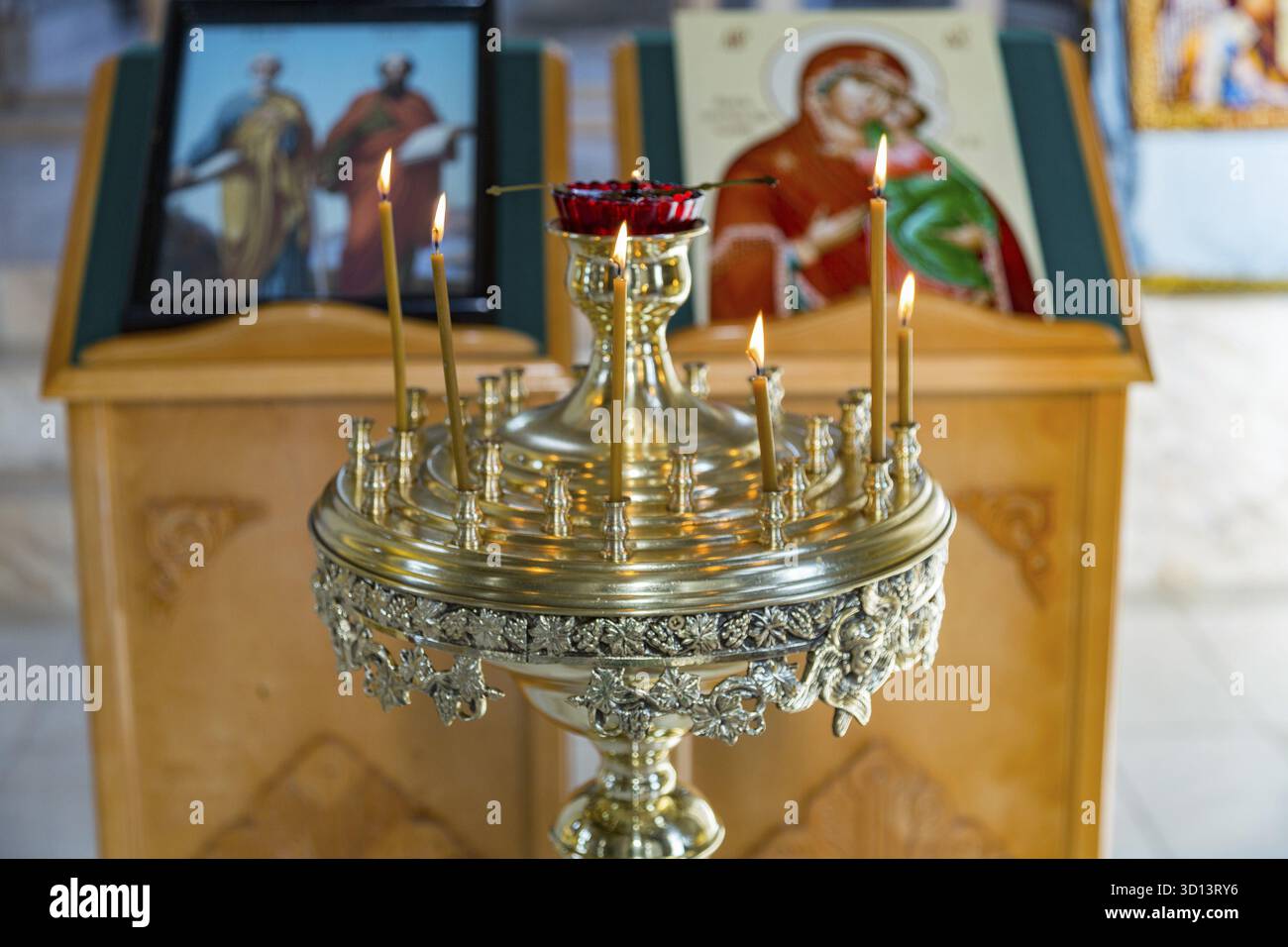 Wax candles on a floor candlestick in the Christian temple Stock Photo ...