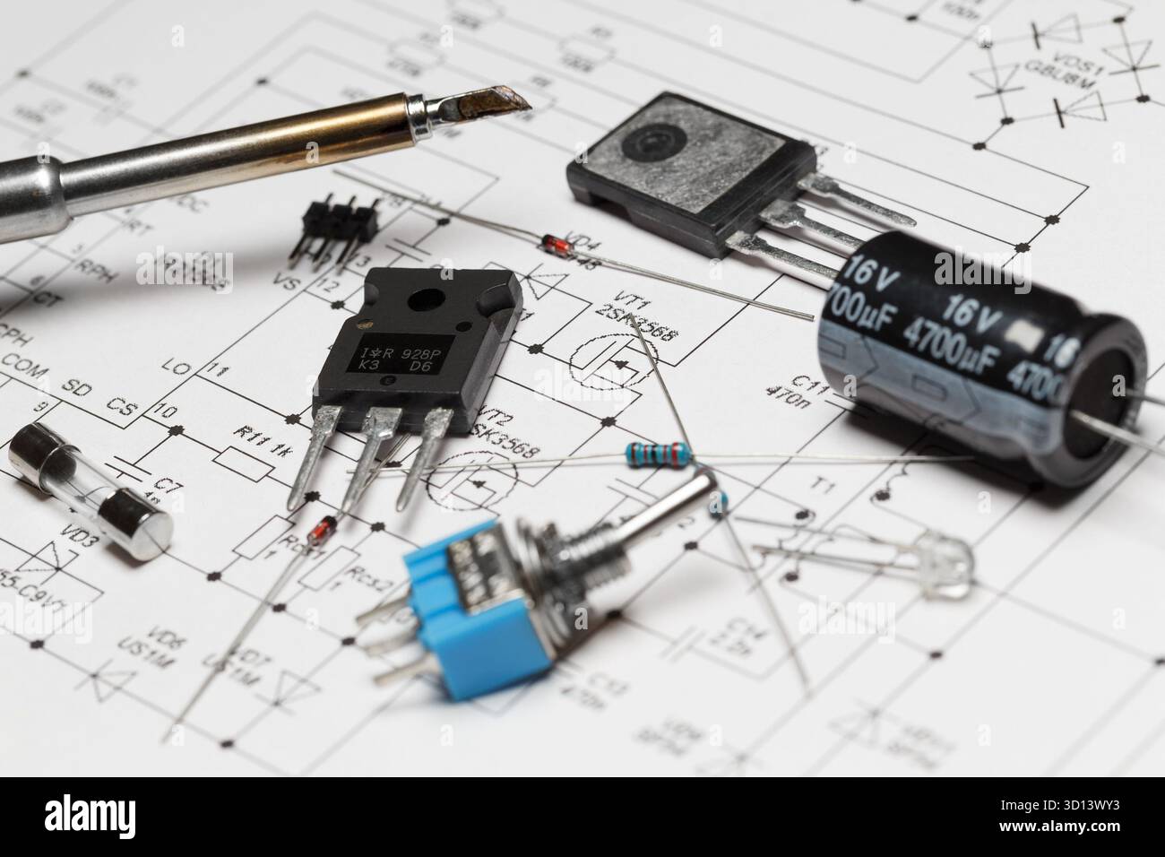 Various radio components and a soldering iron lie on a printed ...