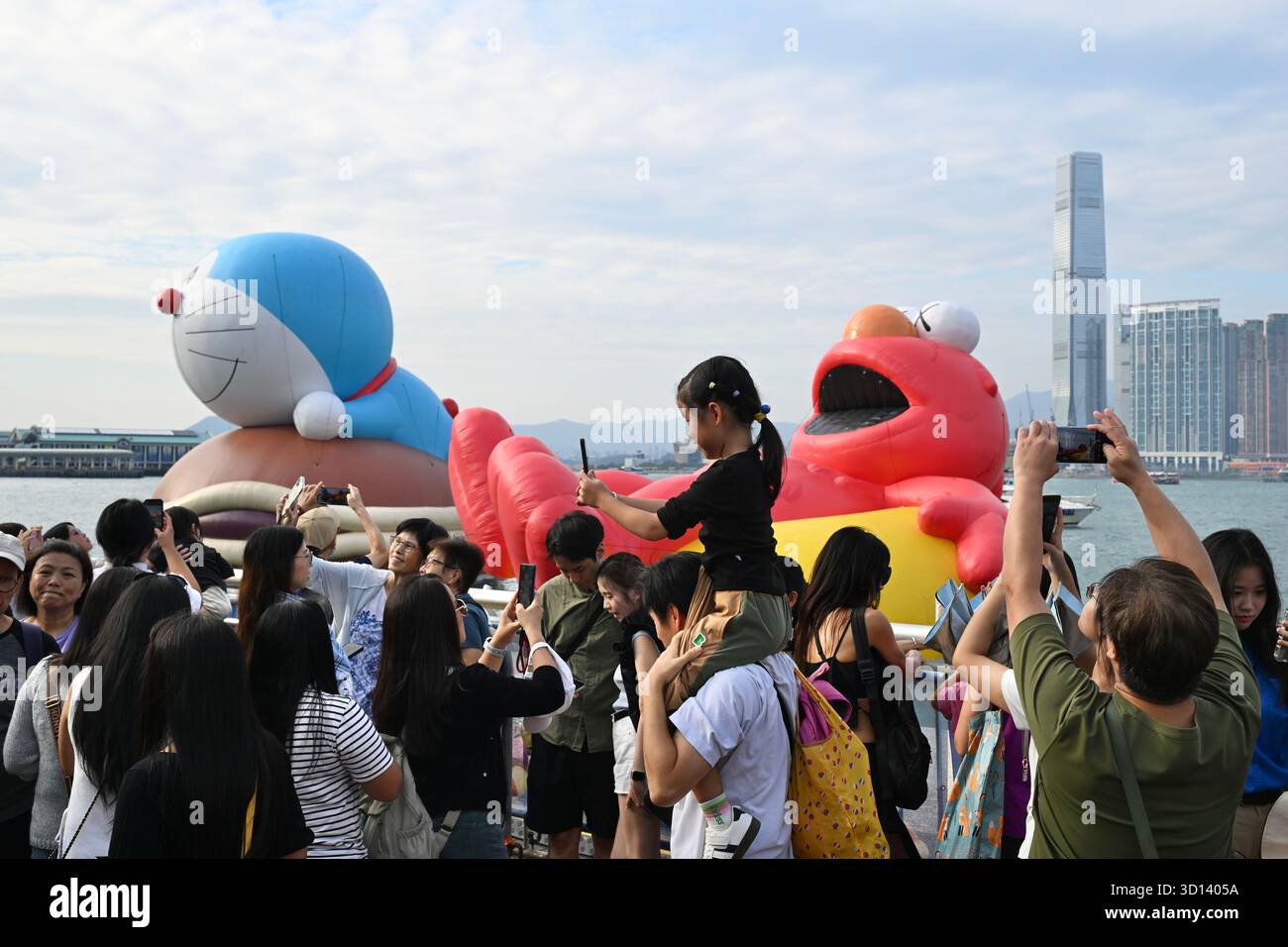 Floating inflatable sculpture of Doreamon and Elmo at the “Water Parade ...