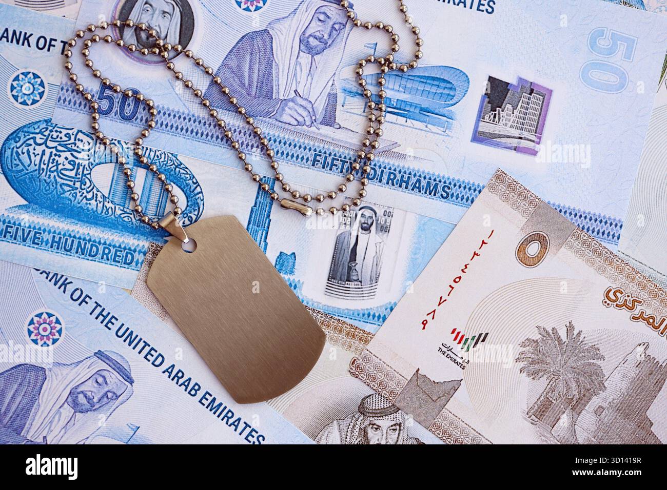 United Arab Emirates dirham currency money bills and military token ...