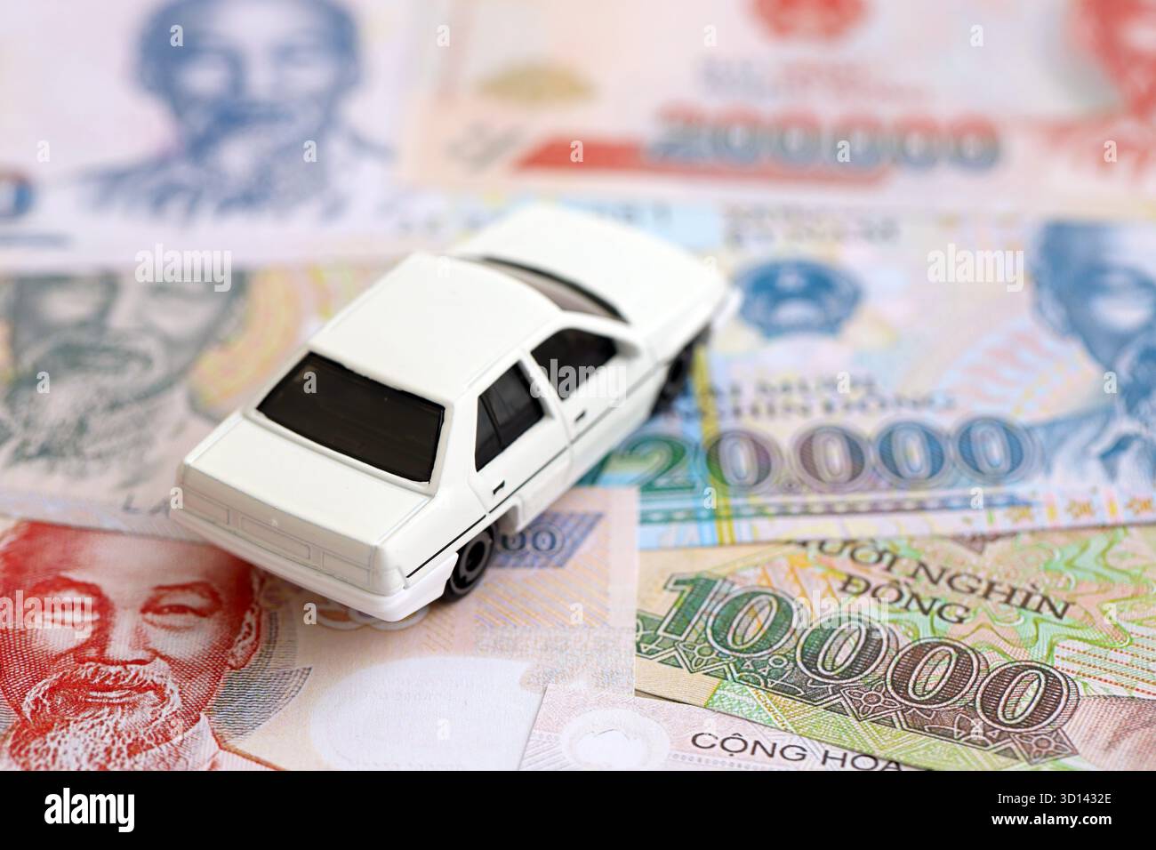 Vietnamese dong currency money bills and toy car close up. The concept ...