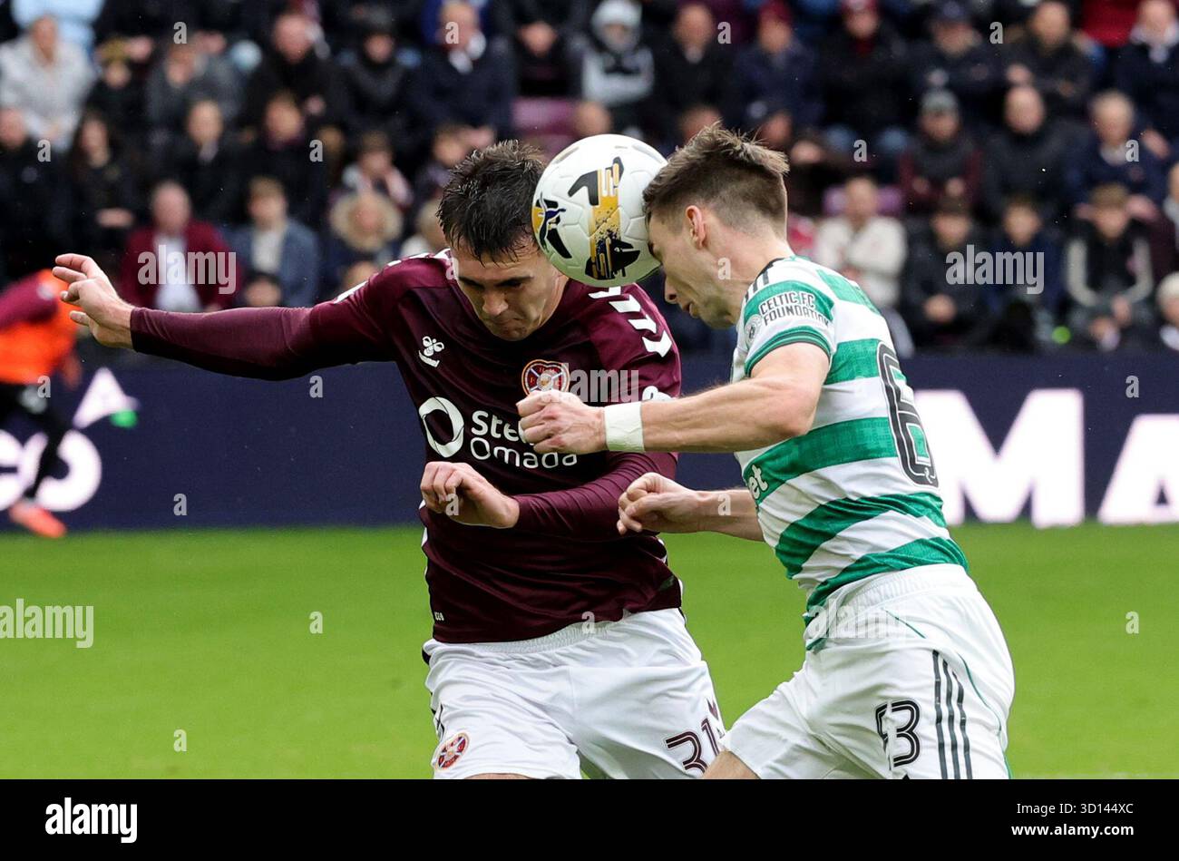 Heart of Midlothian's Oisin McEntee (left) and Celtic's Kieran Tierney ...