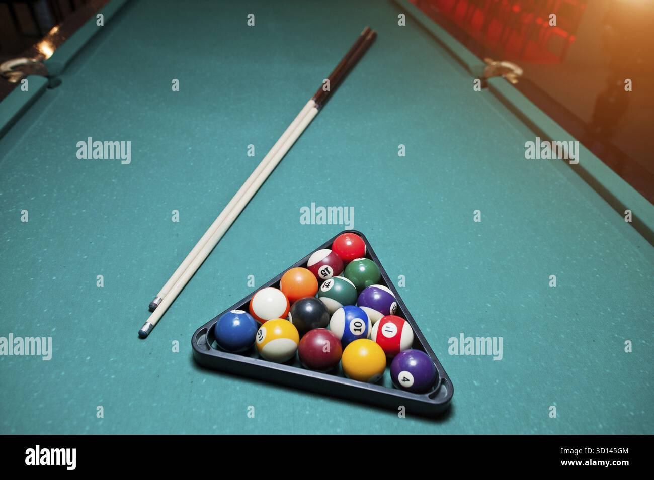 Billiard balls in a pool table at triangle with billiard cue Stock ...