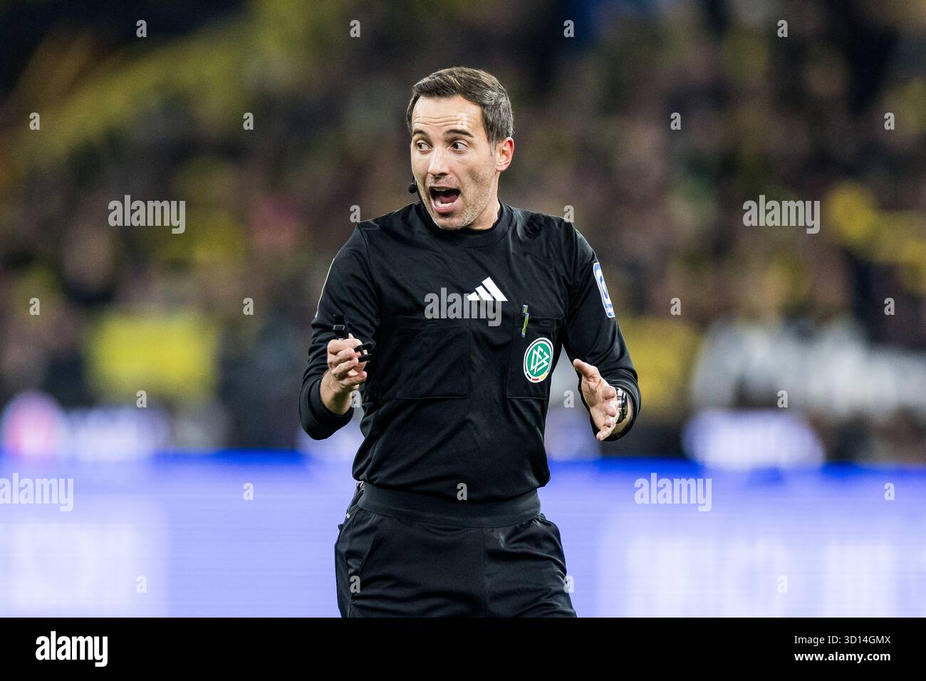 DORTMUND, GERMANY - OCTOBER 25: Referee Benjamin Brand during the ...