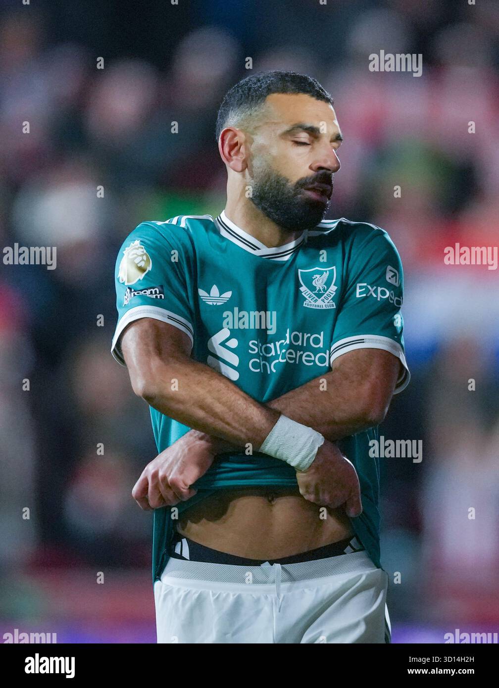Liverpool's Mohamed Salah takes off shirt after defeat in the English ...