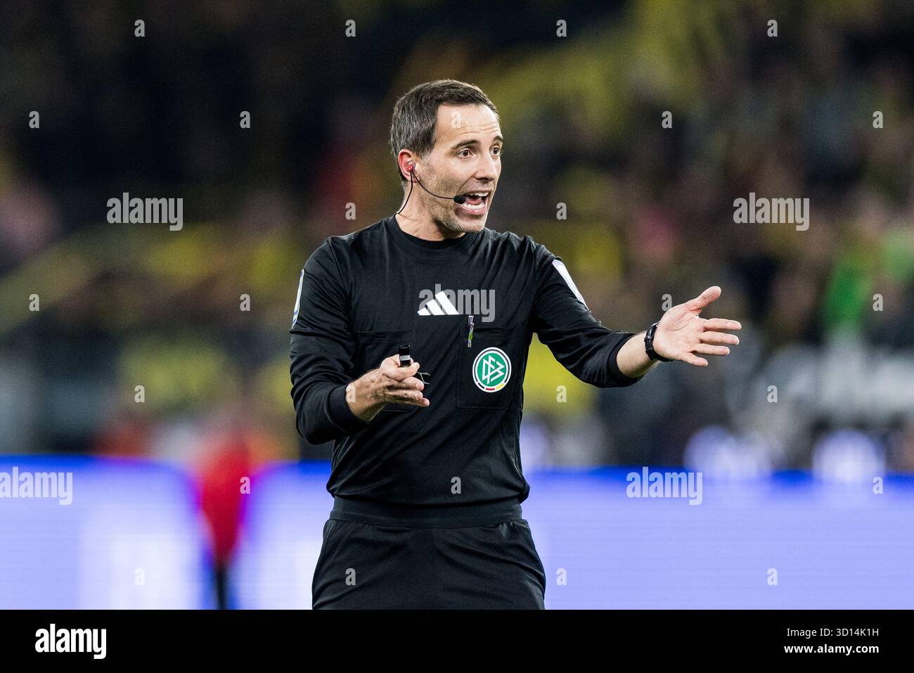 DORTMUND, GERMANY - OCTOBER 25: Referee Benjamin Brand during the ...
