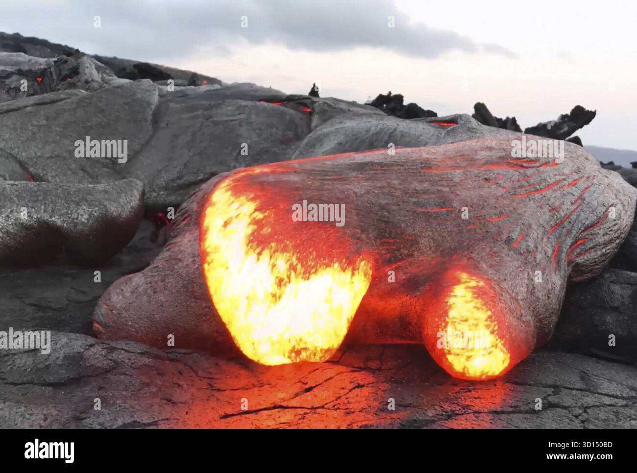 Pouring lava on the slope of the volcano. Volcanic eruption and magma ...