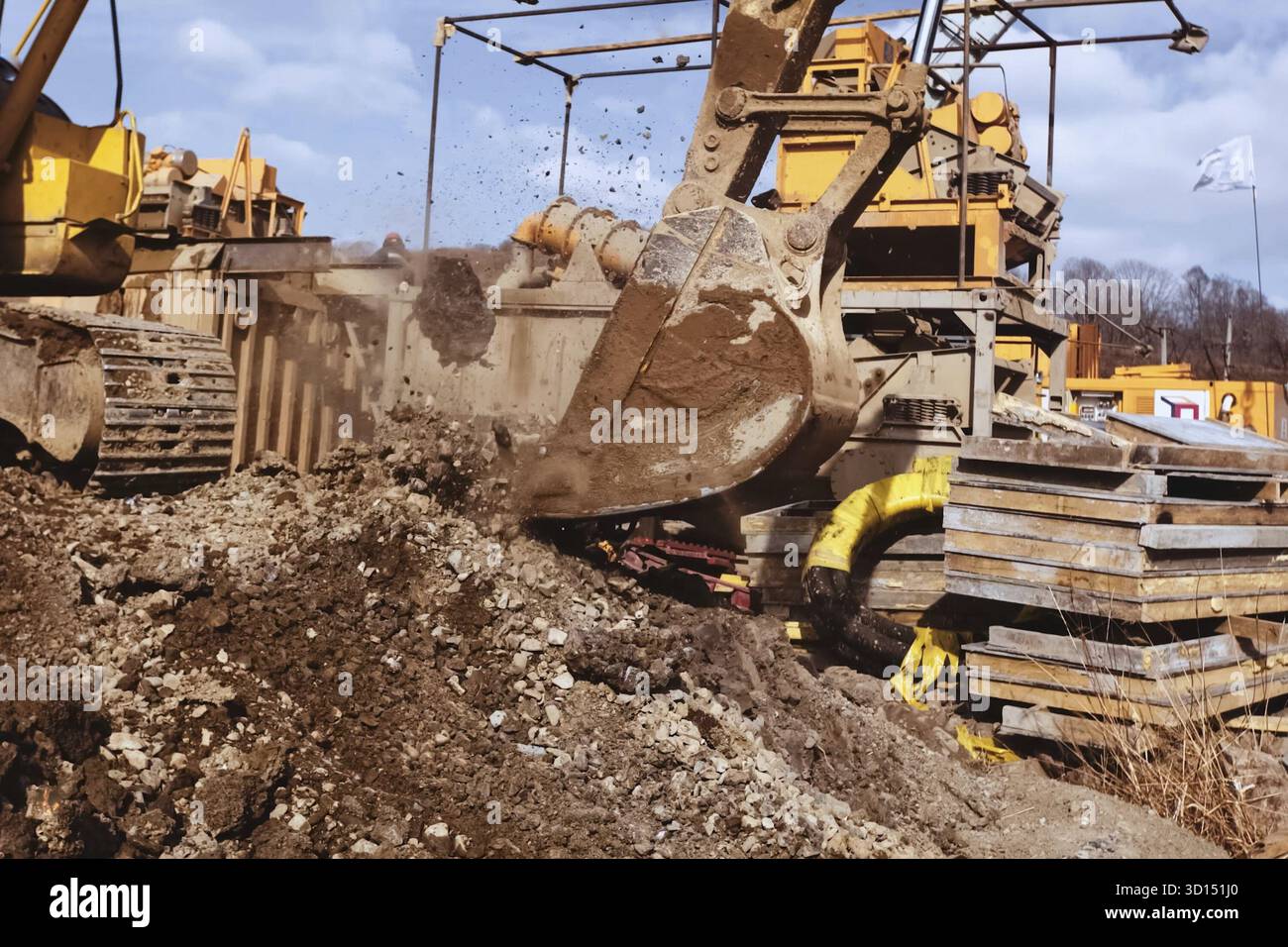 Bulldozer bucket. A bulldozer digs a hole Stock Photo - Alamy
