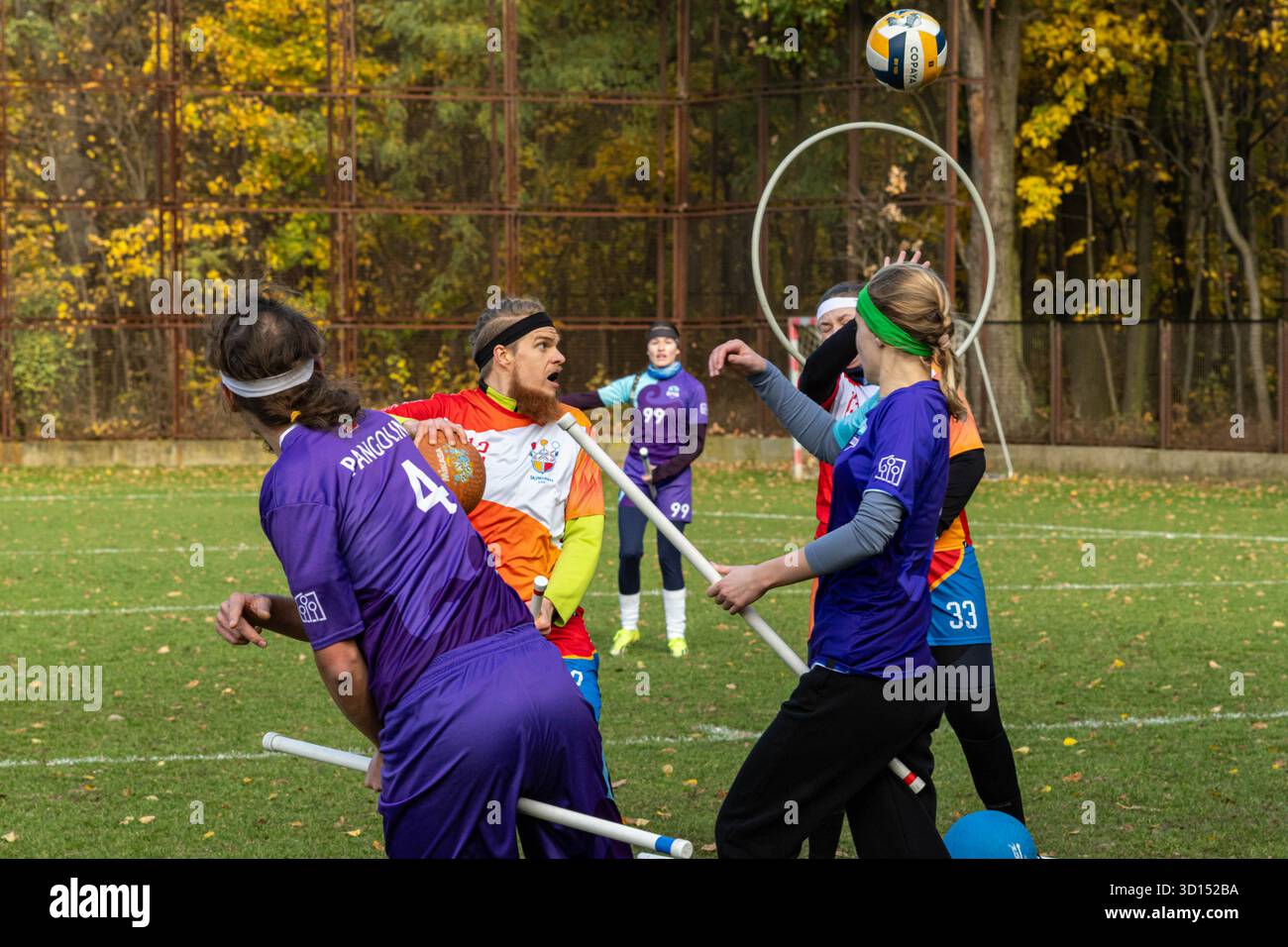 A Warsaw Mermaids player attempts to score through the Quadball hoop ...