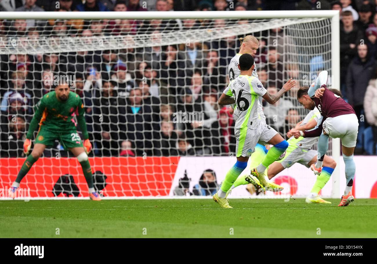 Aston Villa's Matty Cash (right) scores their side's first goal of the ...