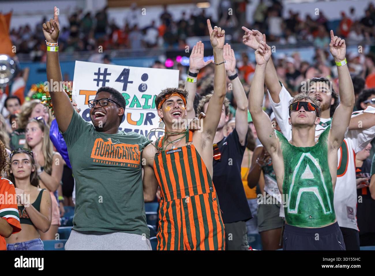 Miami, FL: Fans cheering after the Miami Hurricanes score a touchdown ...