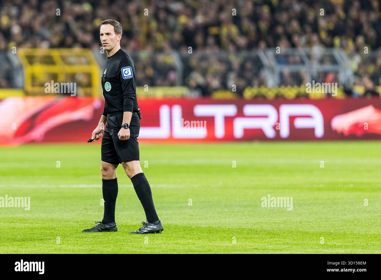 DORTMUND, GERMANY - OCTOBER 25: Referee Benjamin Brand during the ...