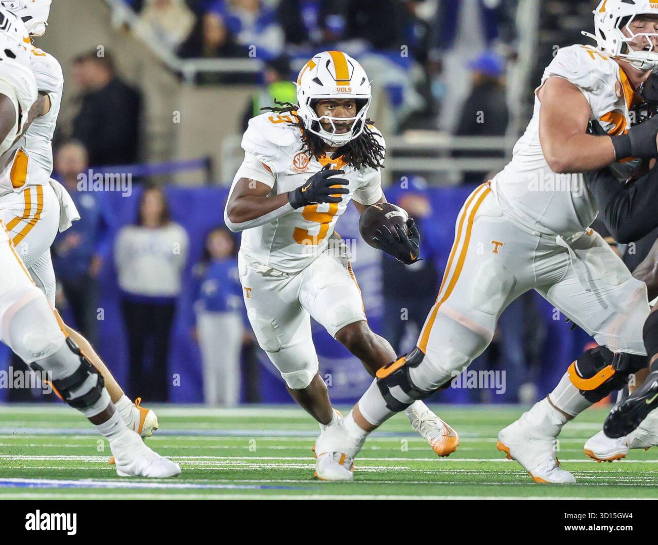 October 25, 2025: Tennessee's Star Thomas (9) runs through a hole in ...