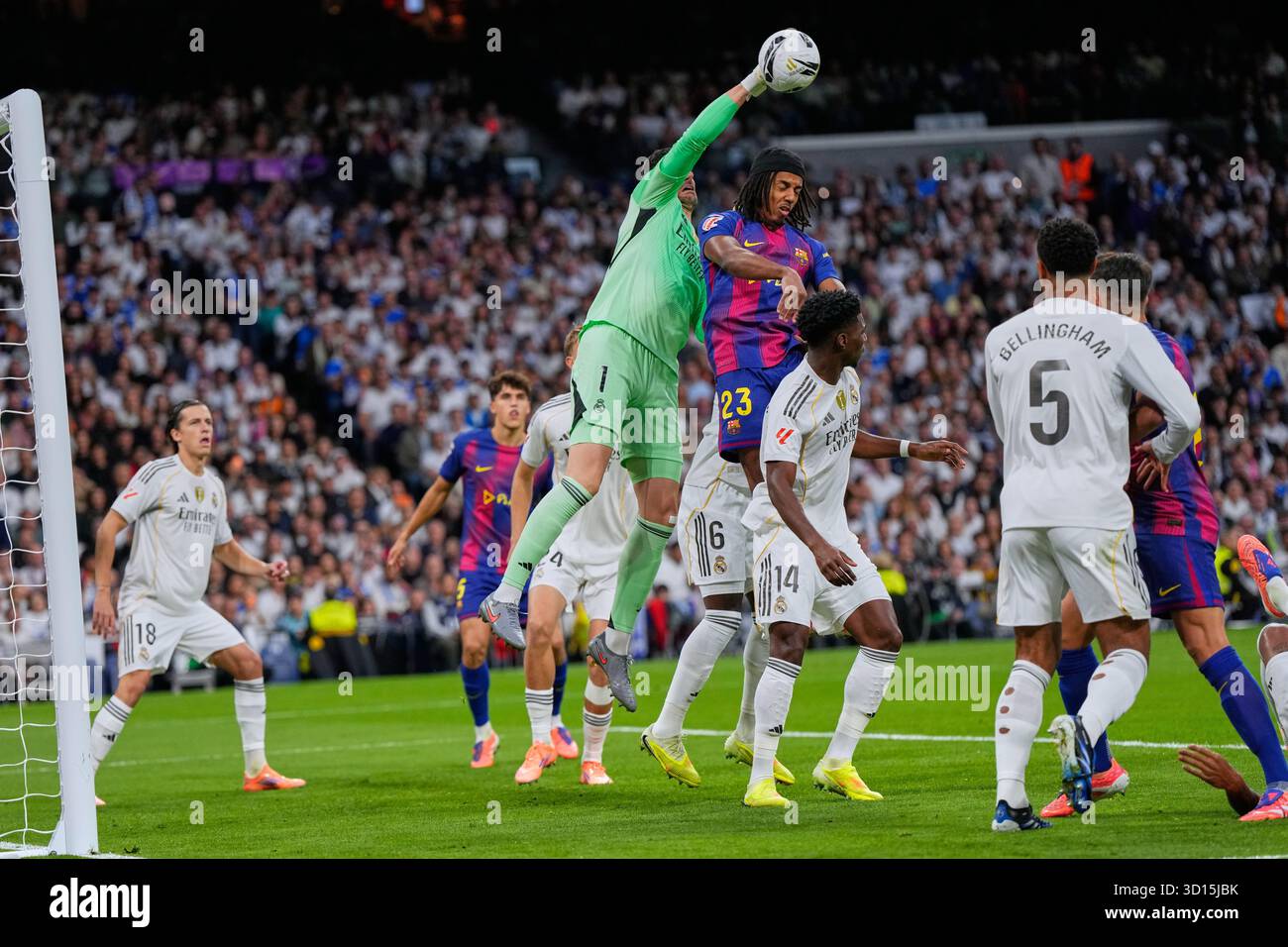 Real Madrid's goalkeeper Thibaut Courtois, top left, clears the ball ...