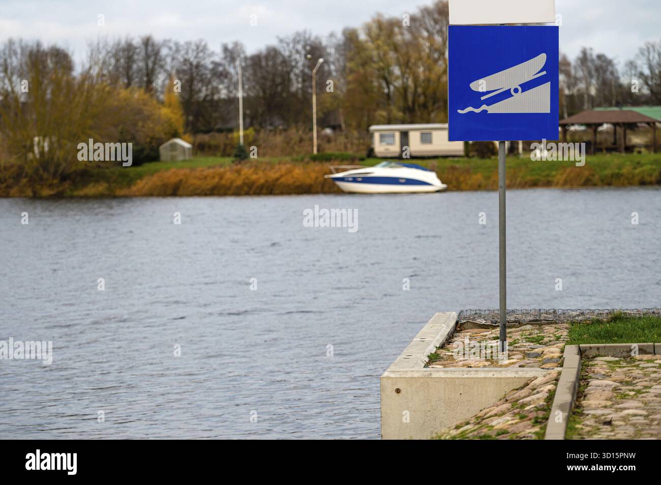 An informative sign at the dry dock with a slip for launching ships in ...