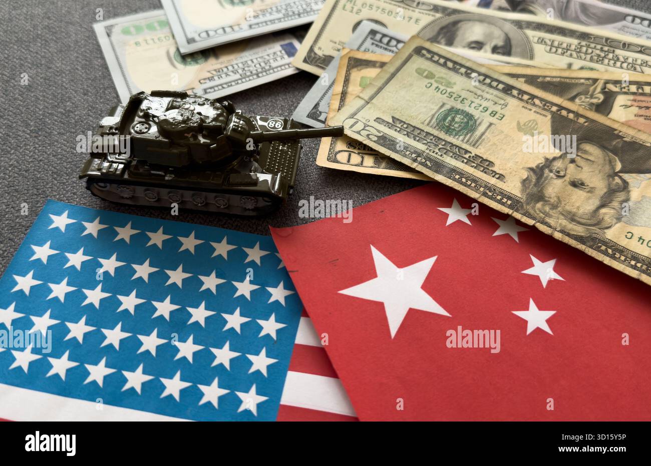 Vietnamese dong currency money bills and toy tank on flag close up. The ...