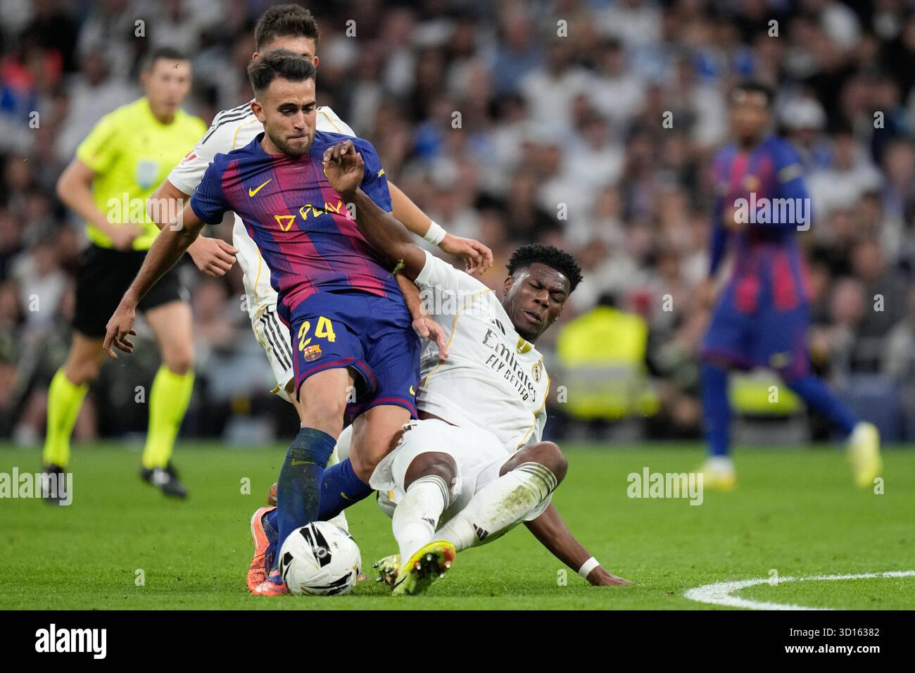 Real Madrid's Aurelien Tchouameni blocks Barcelona's Eric Garcia during ...