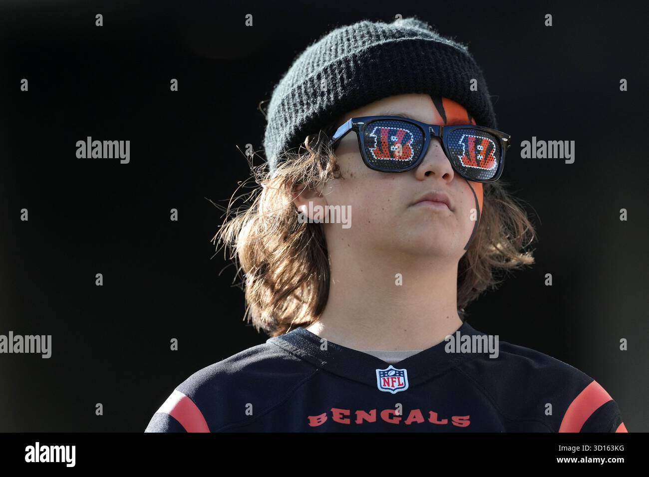 A Cincinnati Bengals fan watches warm ups before an NFL football game ...
