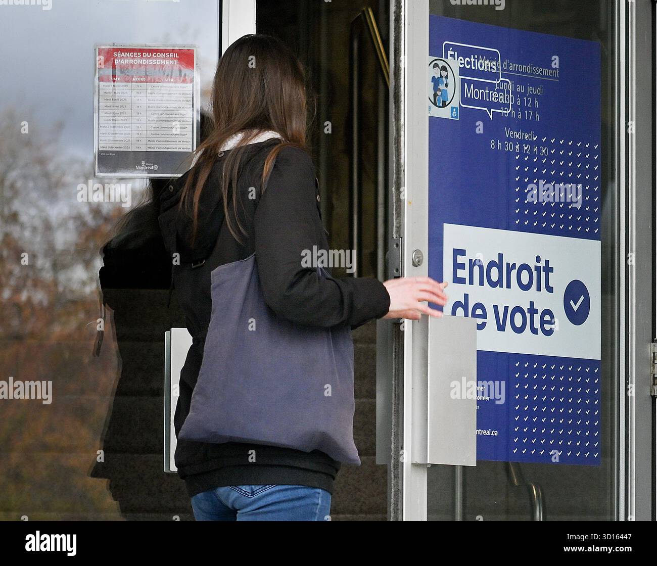 A person arrives to cast their ballot at a polling station in Montreal ...