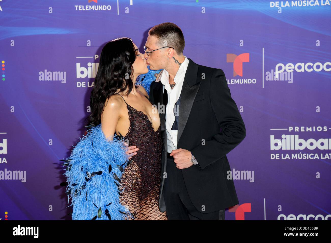 MIAMI, FLORIDA - OCTOBER 23: Kenia Os and Peso PLuma attend the 2025 ...