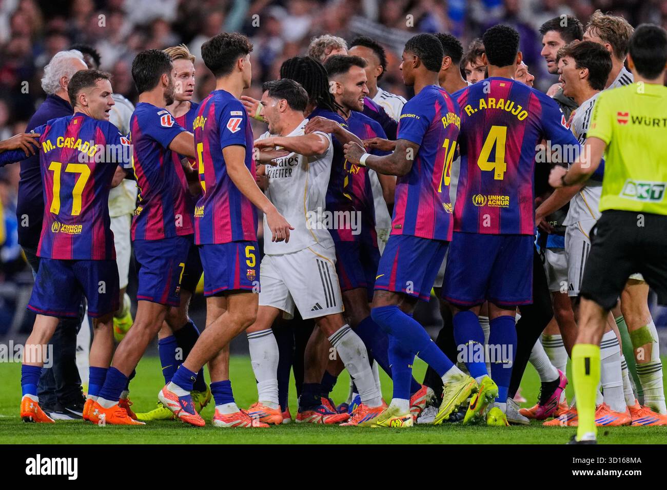 Real Madrid and Barcelona players scuffle during the Spanish La Liga ...